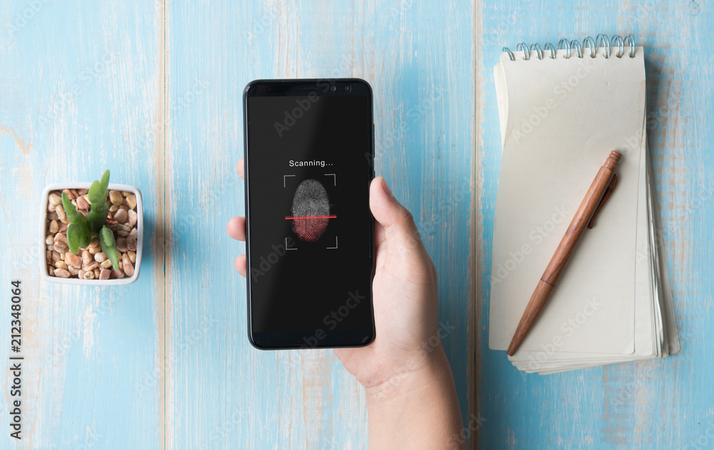 Hand holding smartphone with process of scanning fingerprint,unlock ...