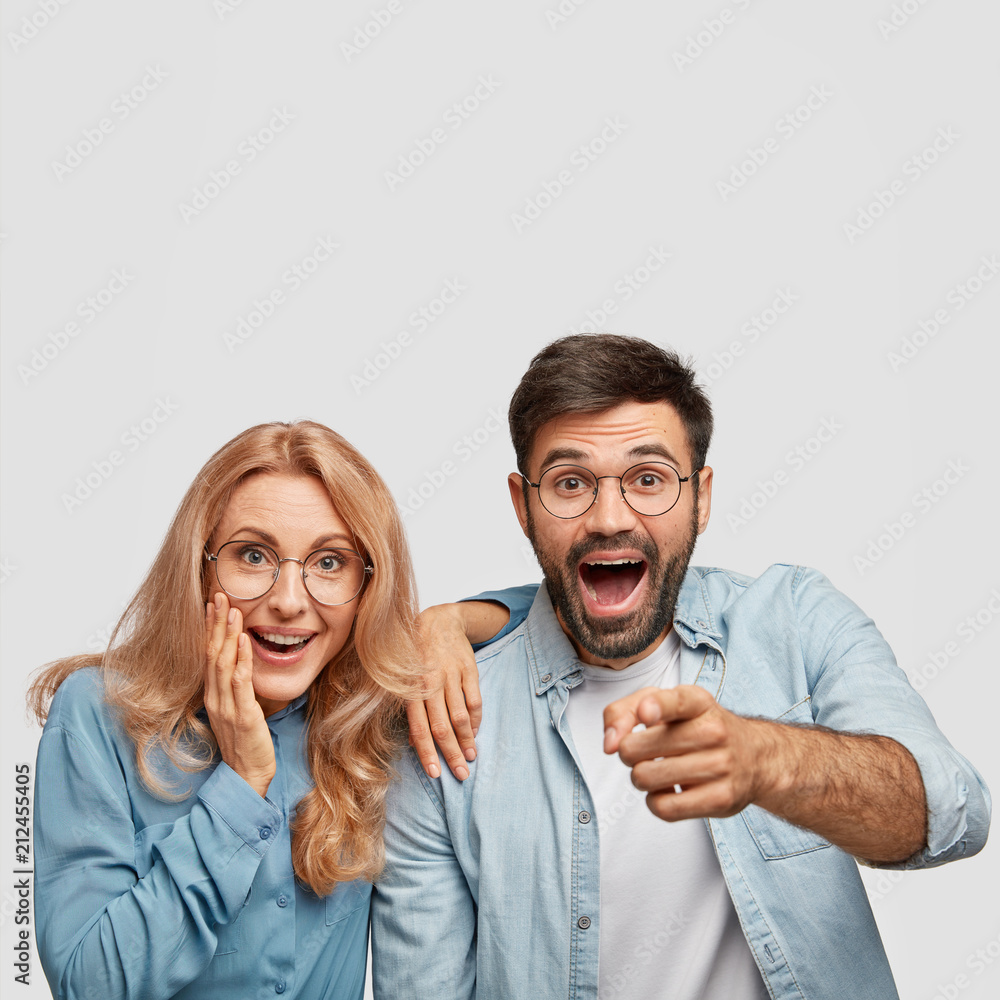 Happy positive middle aged young male and female best friends giggle as ...