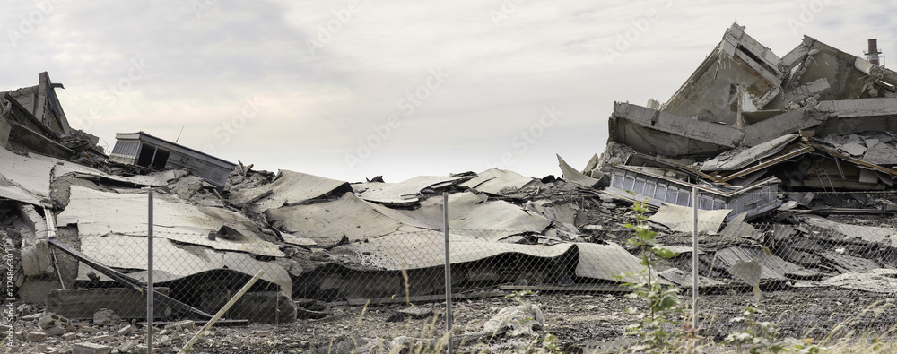 Industrial concrete building destructed by strike. Disaster scene full ...