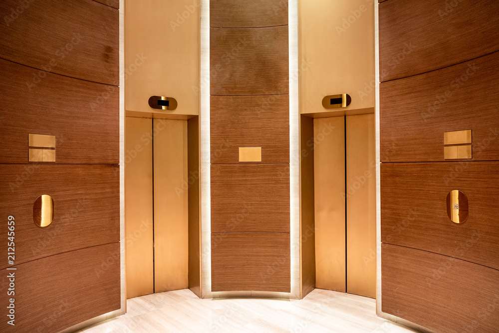 Closed elevator doors. Contemporary interior wooden curve Stock Photo ...
