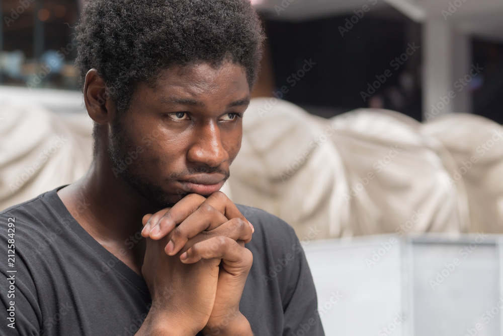 thoughtful african man thinking, planning; portrait of serious, worried ...
