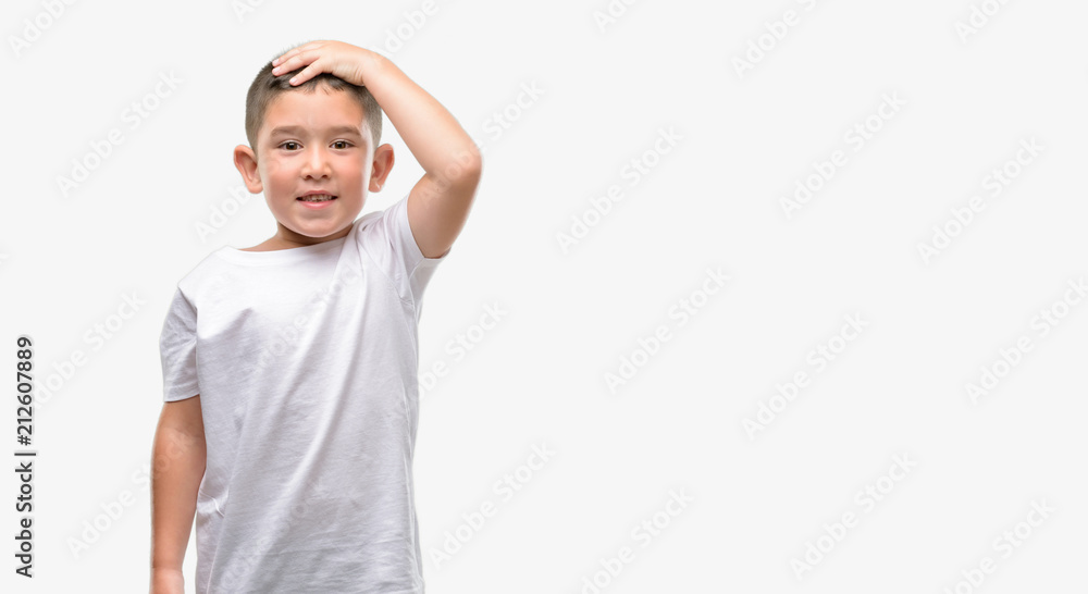 Dark haired little child stressed with hand on head, shocked with shame ...