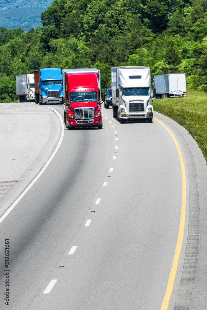 Squadron of Heavy Trucks On Interstate With Copy Space Stock Photo ...