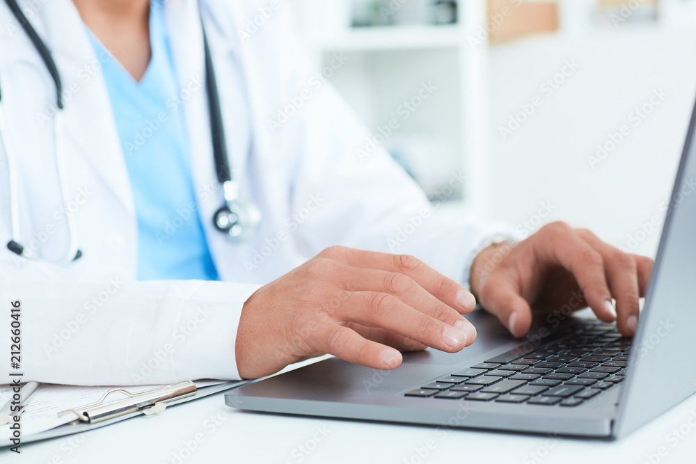 Male doctor, medical students or surgeon using laptop during the ...