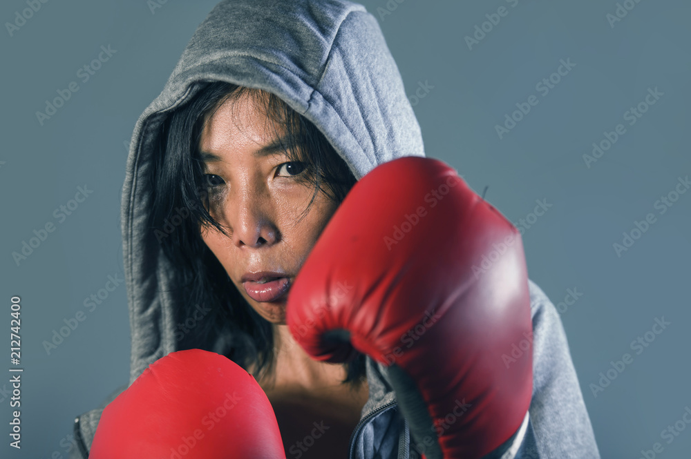young fit and healthy Asian Korean boxer woman in fitness top hoodie ...