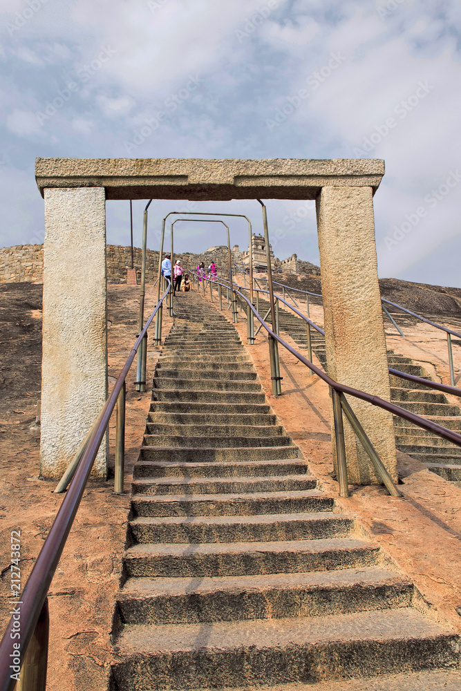 Gateway and rock cut steps leading to the Gomateshwara temple ...