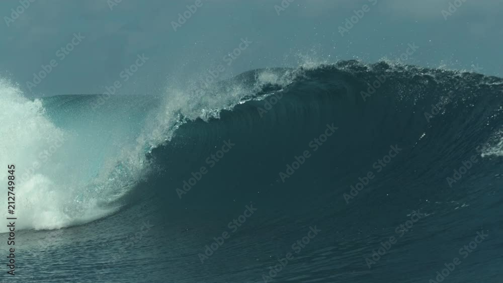 SLOW MOTION CLOSE UP: Powerful glistening barrel wave surges past a ...
