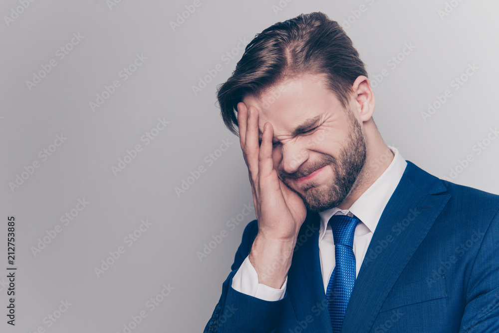 Portrait of disappointed, upset man with stubble in blue suit, cover ...