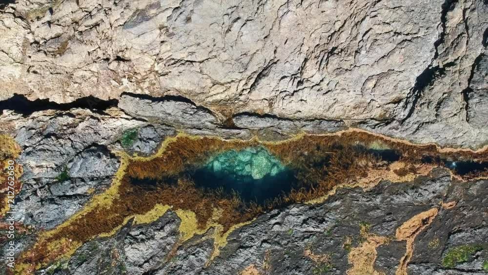 Stockvideon Stunning close up aerial drone view of a rock pool at the ...