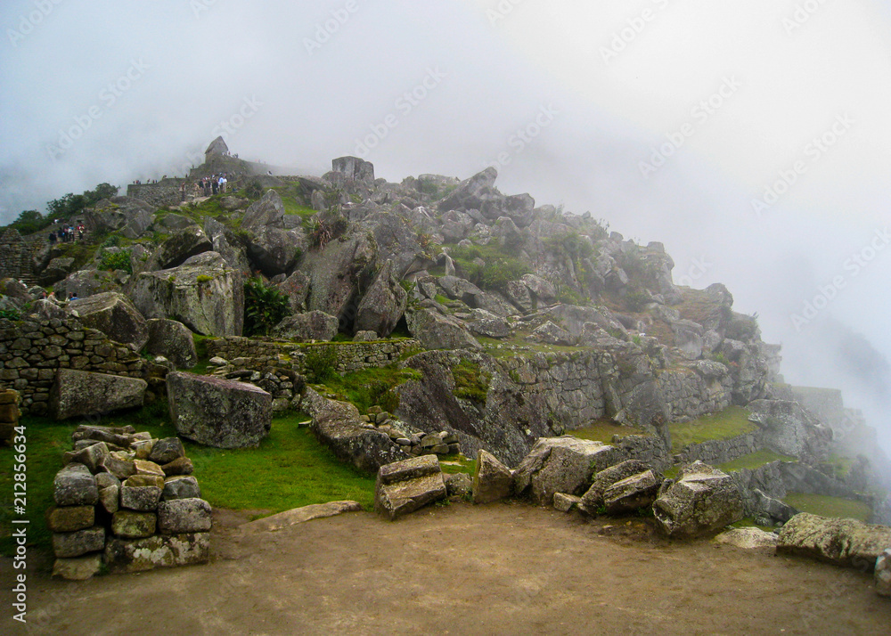 Stone magical ancient ruins along the paved path Inca Trail to Machu ...