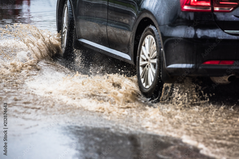 dirty water splash after vehicle roaring by Stock Photo | Adobe Stock
