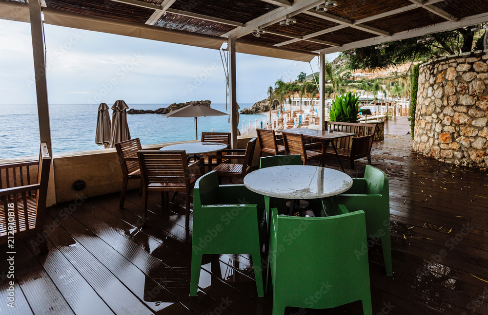 The interior of the summer bar on the waterfront. In the background ...
