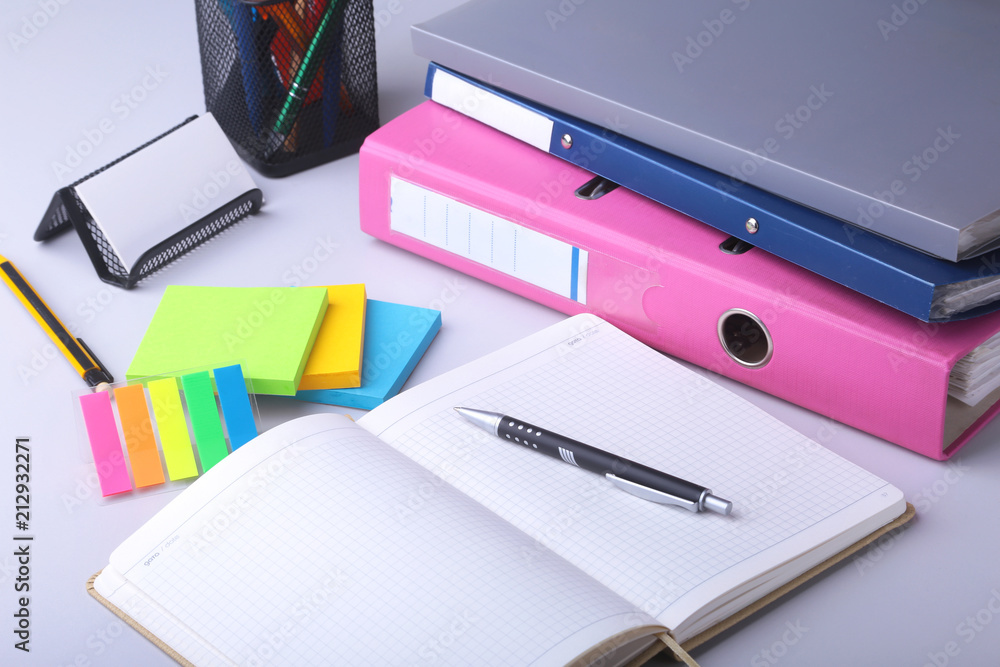Folder file, note, pen and watch on the desk. blurred background. Stock ...