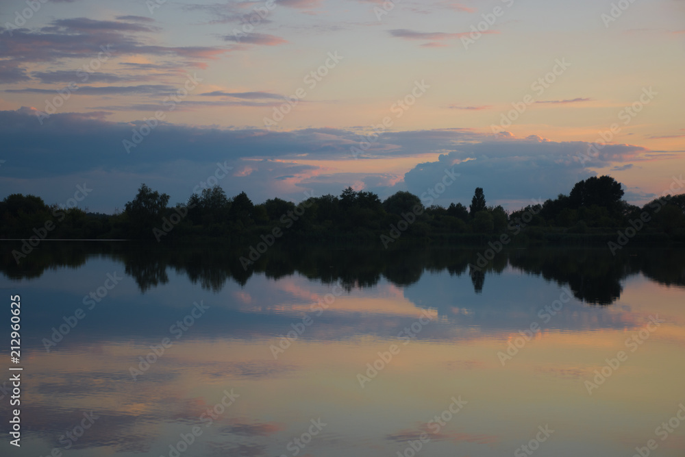 Landscape - stunning dusk at the summer lake with dynamic clouds Stock ...