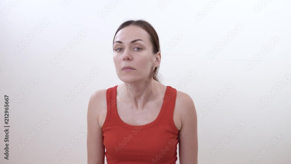 Portrait of a brunette woman turning the head left and right. Doing ...