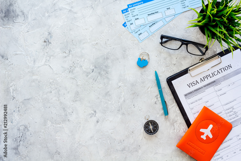 Documents for travel abroad. Visa application form, pen, passport cover ...