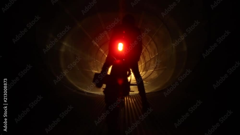 A motorcycle being ridden from inside a jet engine testing exhaust ...