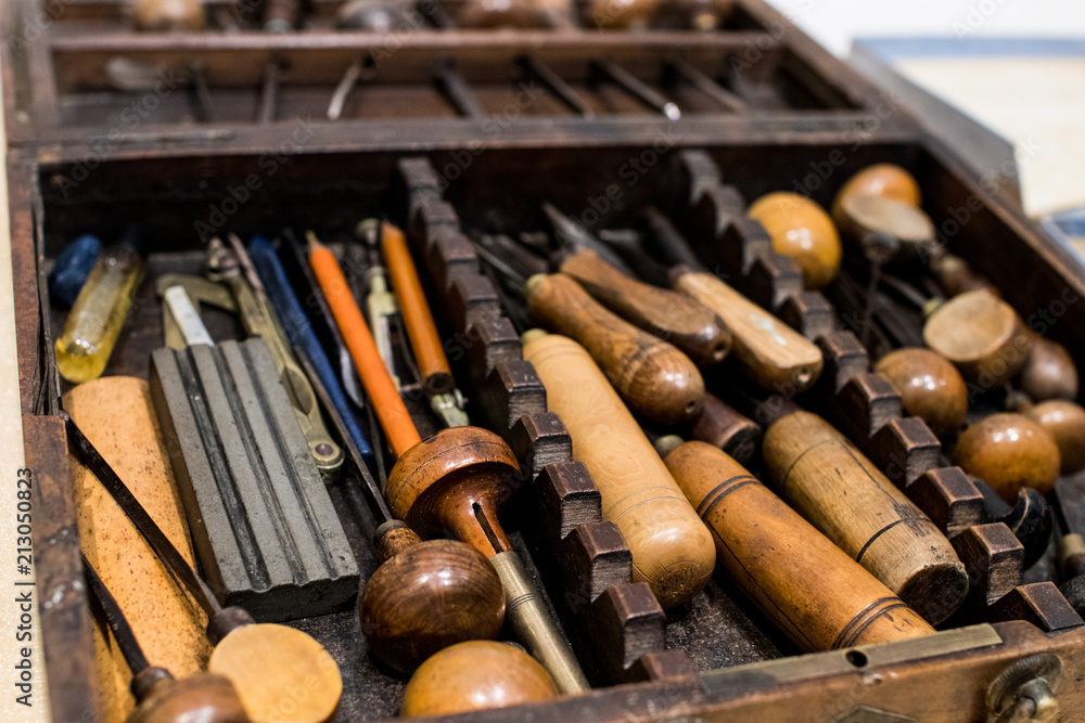 Antique tools for engraving and printing in a wooden case. Tools for ...