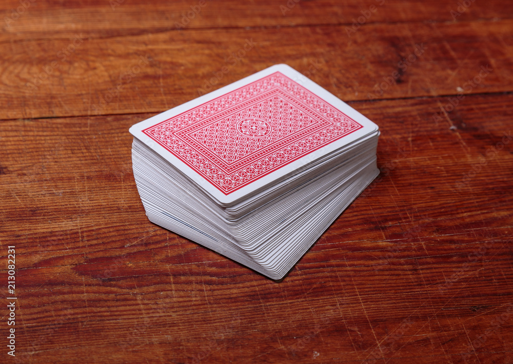 deck of cards on wooden table Stock Photo | Adobe Stock
