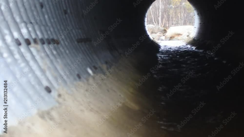Culvert - drain under road for small river. Big pipe under freeway ...