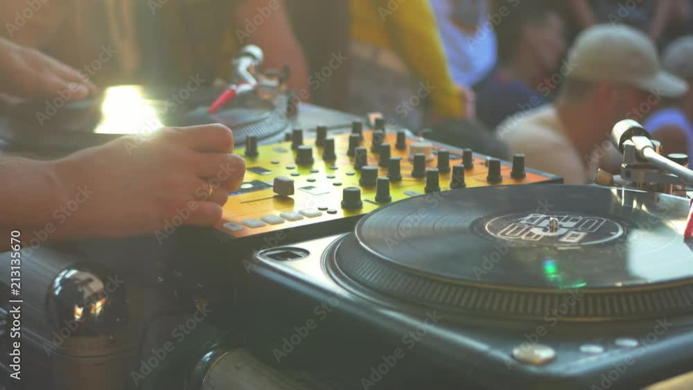 close up dj hand scratching vinyl record on turntable on a party Stock ...
