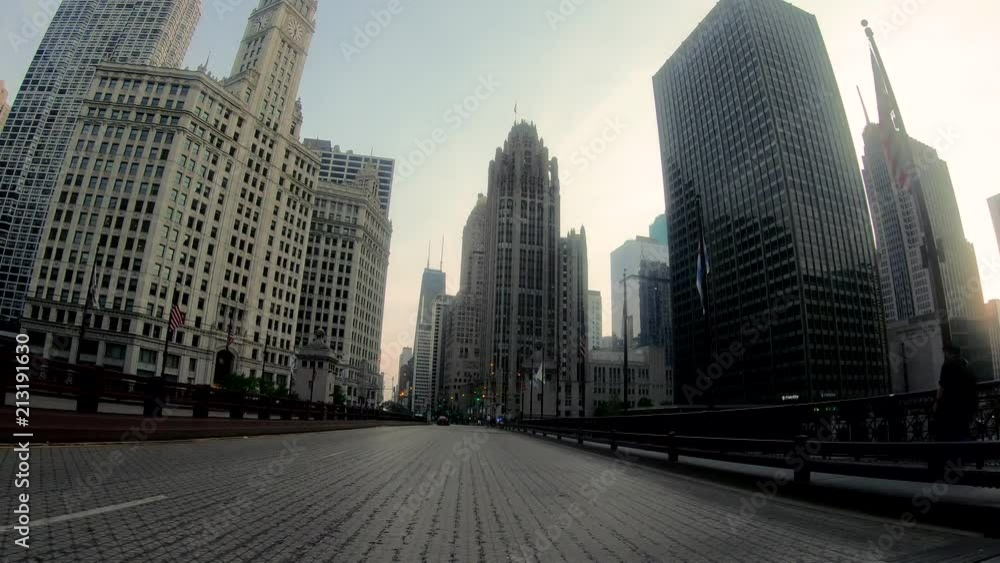 Driving through Chicago downtown past its famous skyline and buildings ...