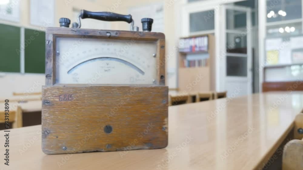 Old style voltmeter or ammeter with pointer showing different electric ...