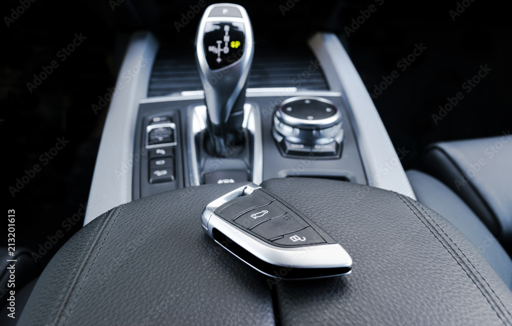 Closeup inside vehicle of wireless key ignition. Start engine key. Car ...