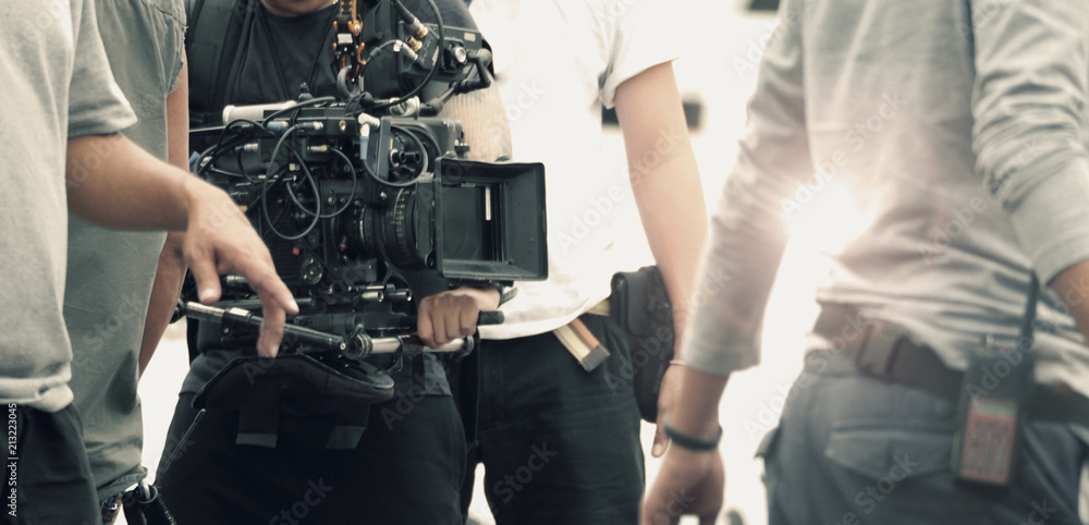 Blurred images of high definition video camera and lens on steady ...