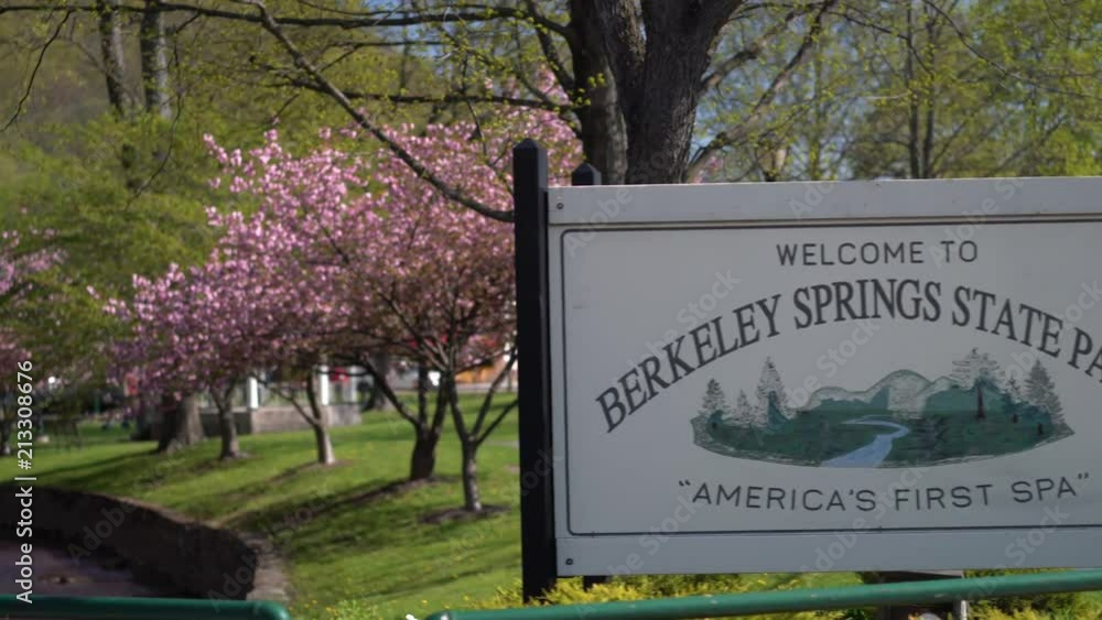 Camera panning across from sign showing Berkeley Springs State Park to ...