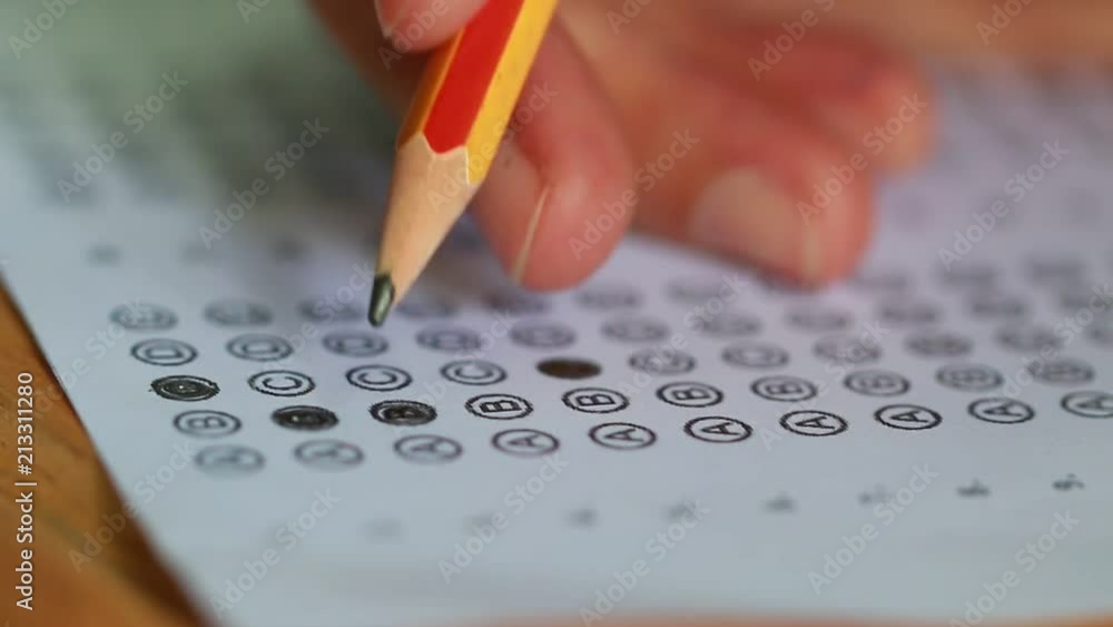 Hands with pencil over application form, Students taking exams, writing ...