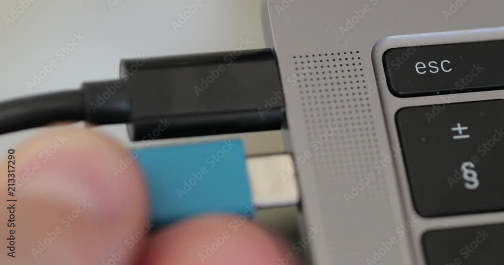 Plugging in a usb type c cable to a laptop computer. Stock ビデオ | Adobe ...