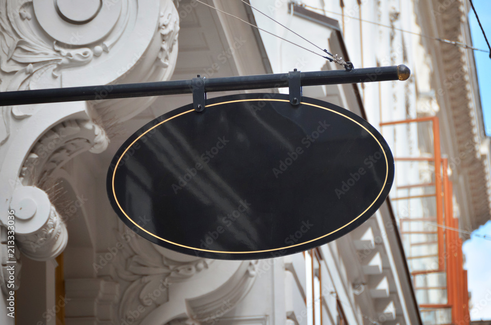 Oval shape signage in old city center. Blank surface for logo design ...