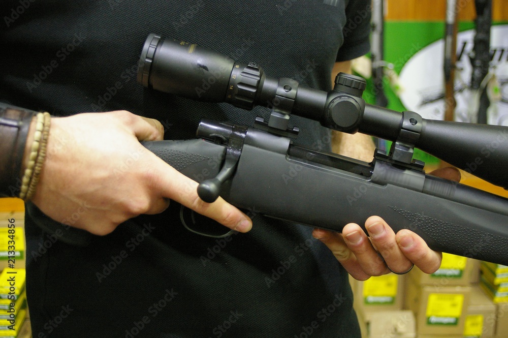 Guns, Firearms and hunting Rifles on display to be sold at a gun shop ...