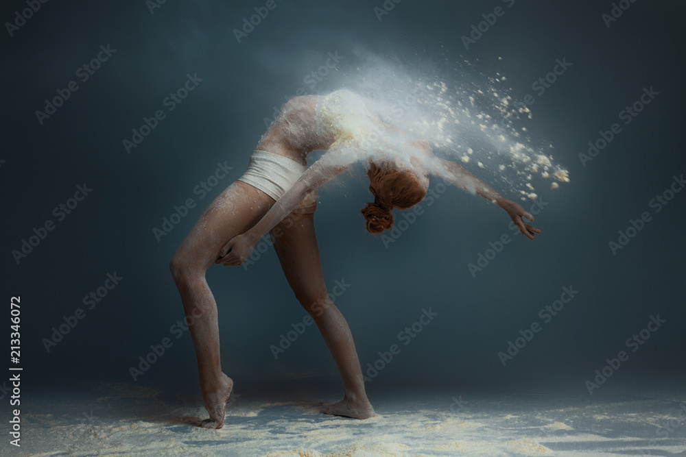 Dancing in flour concept. Redhead beauty female girl adult woman dancer in dust / fog. Girl ...