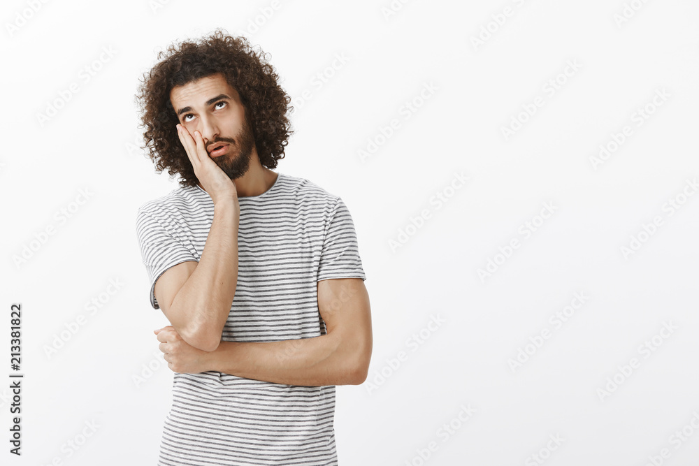 Bored indifferent handsome hispanic man with beard and afro hairstyle ...