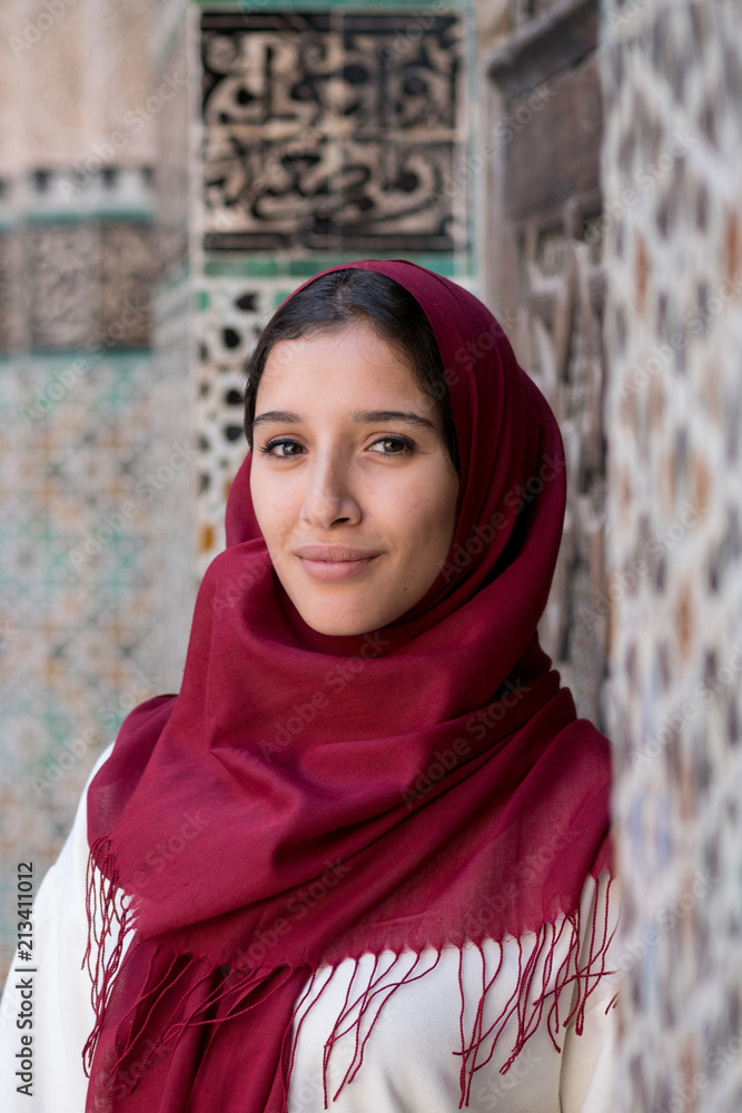 Muslim woman in traditional clothing with red hijab on her head Stock ...