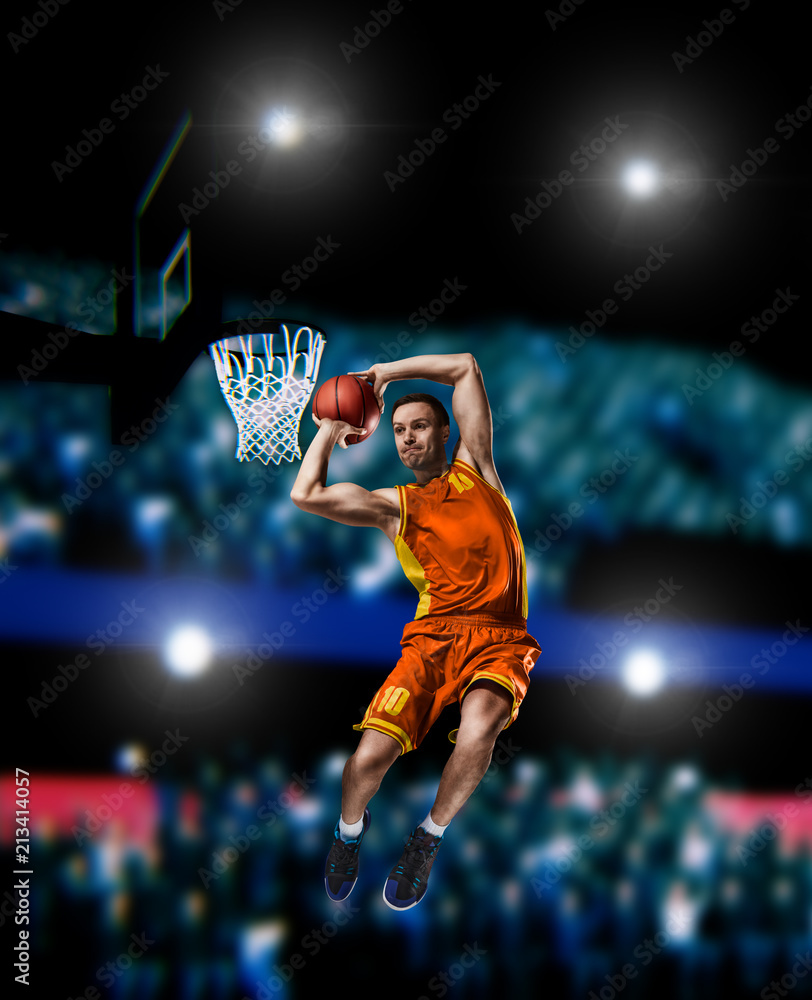 basketball player making slam dunk on basketball arena Stock Photo ...