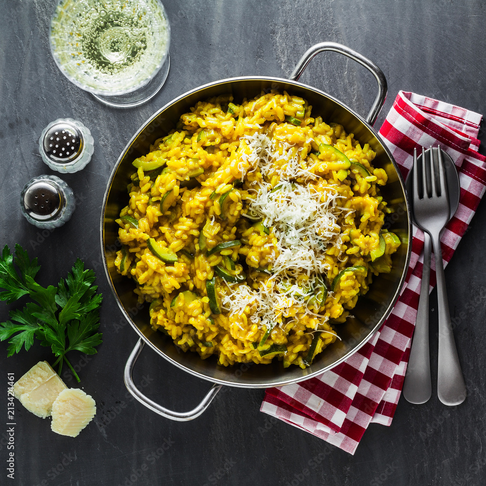 Italian dish yellow Risotto milanese with saffron, zucchini and ...
