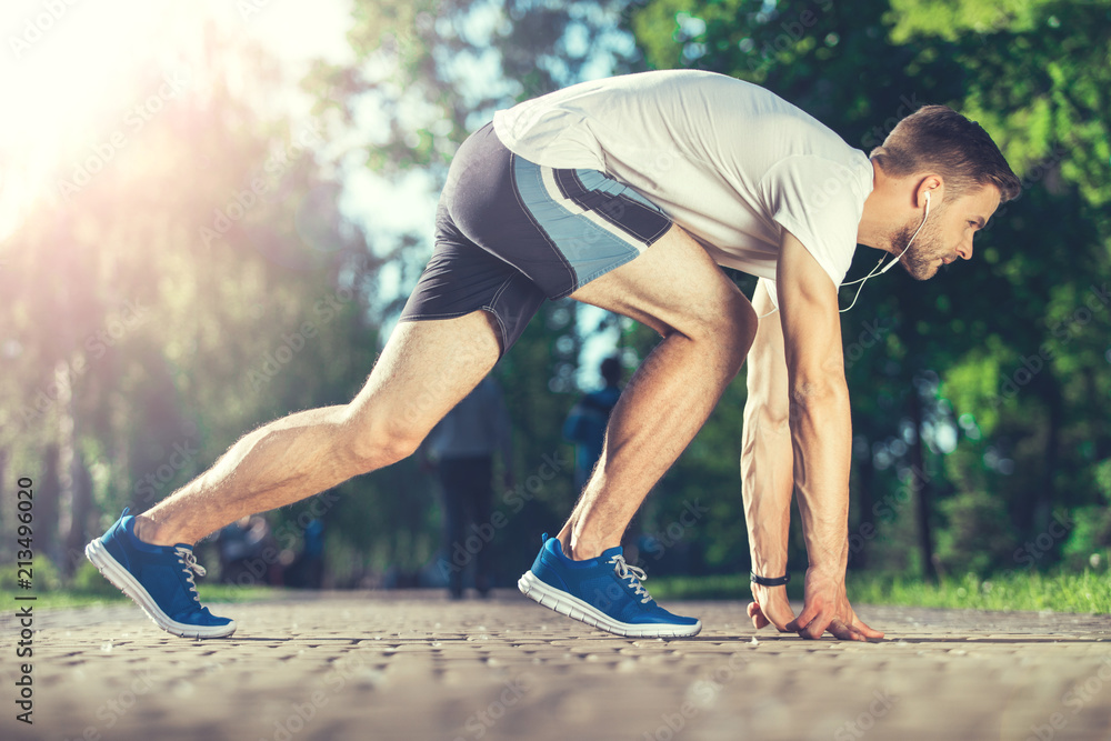 Full length profile of concentrated man bending his body before ...