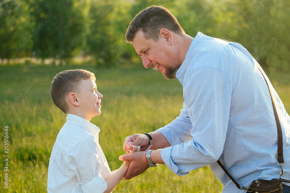 caring father taking care and use wet wipes on the son Stock Photo ...