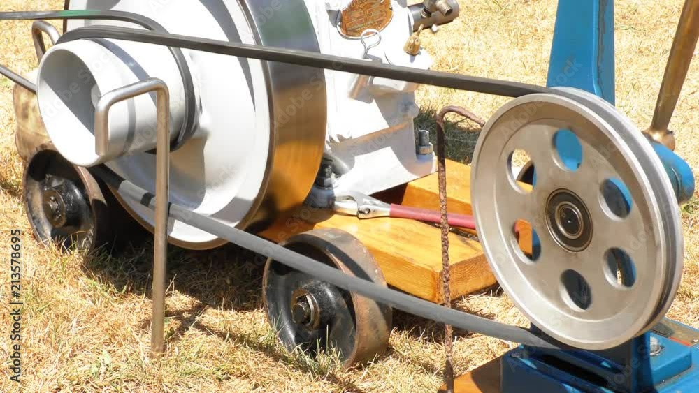 Flywheel turning on a stationary engine machine pump Stock ビデオ | Adobe ...