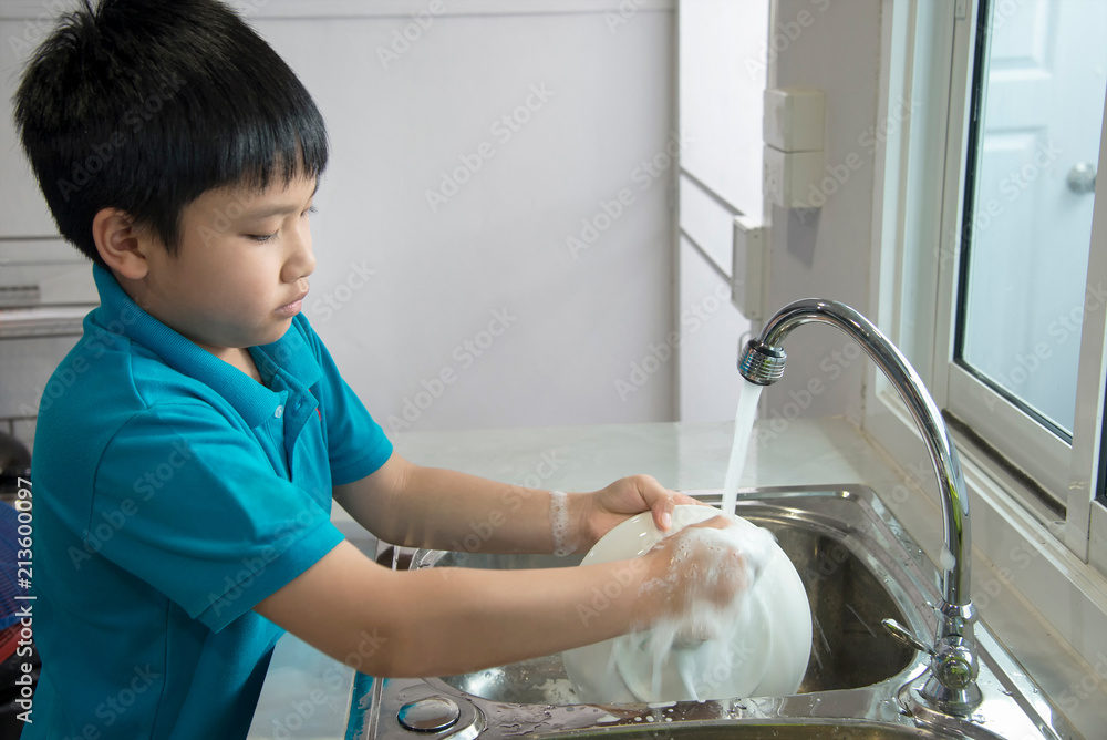 Kid Washing The Dishes