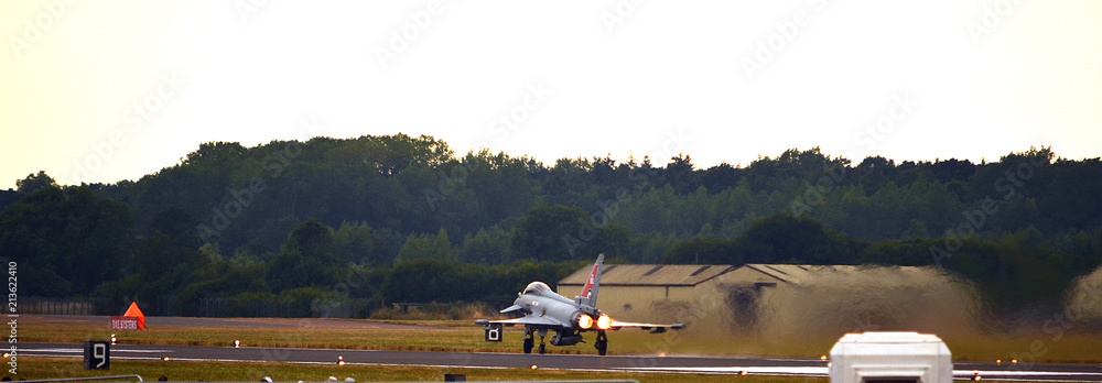 military fighter jet taking off from air base Stock Photo | Adobe Stock