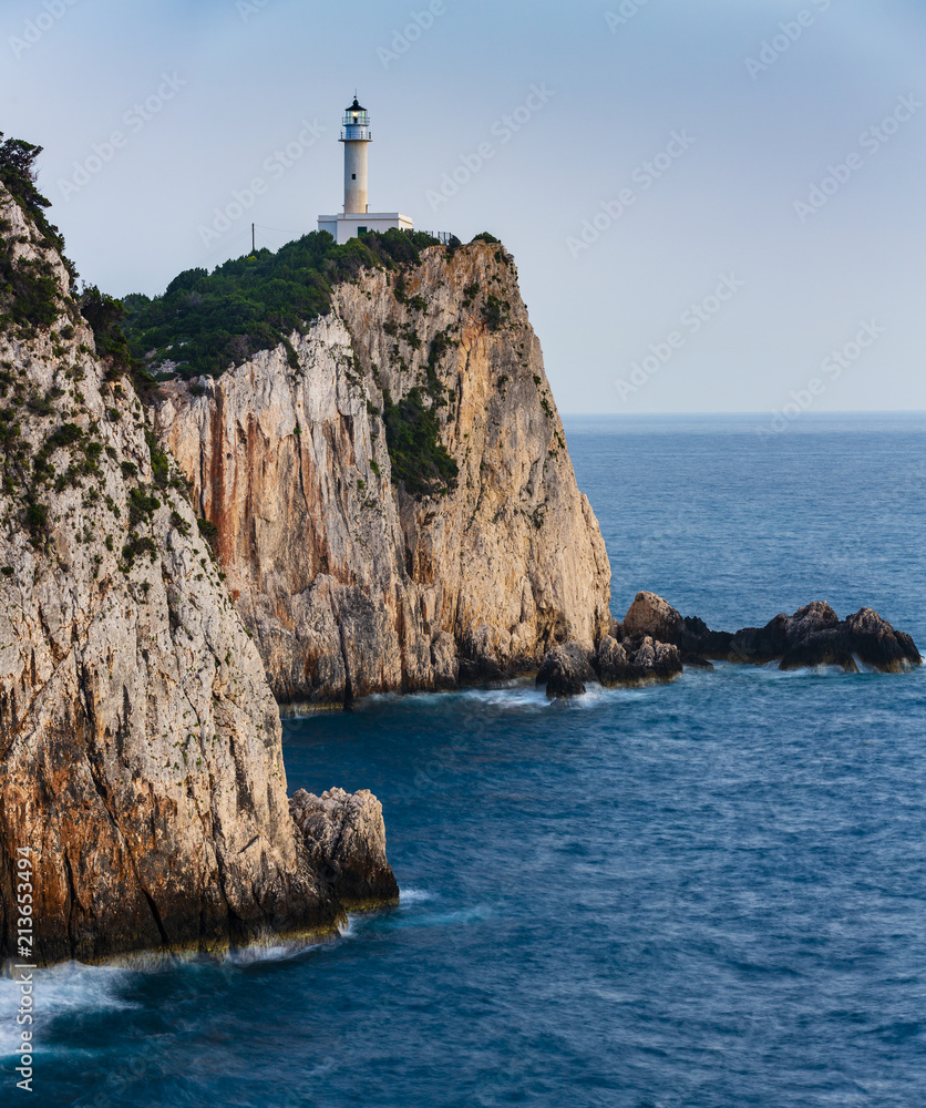 Sunset view with magical lighthouse over Cape of Doukato, Lefkada ...
