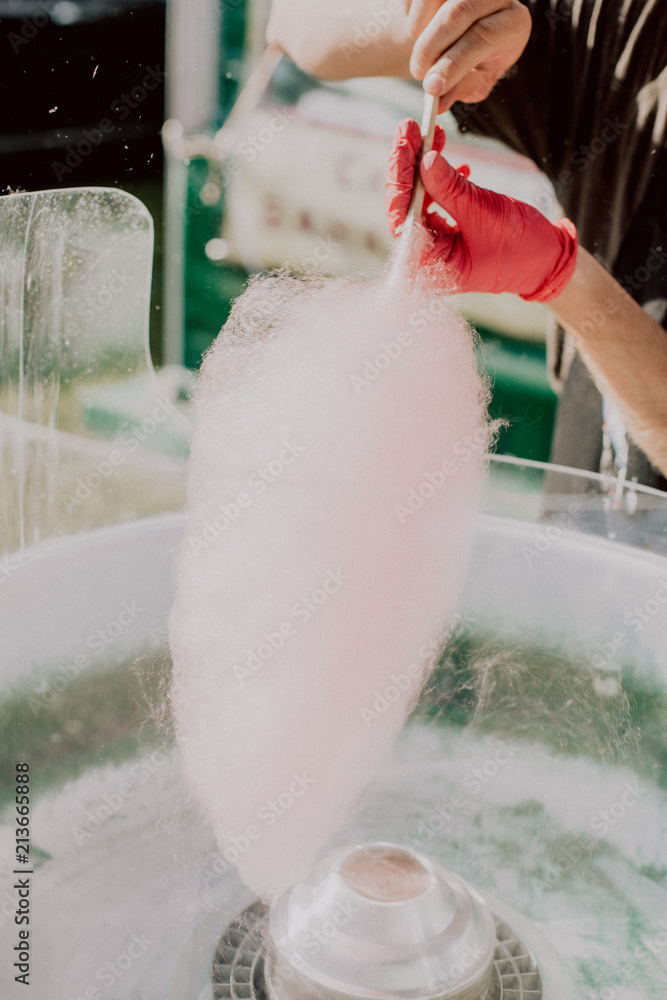 Candy Floss Machine. Man making Pink Cotton Candy Stock Photo | Adobe Stock
