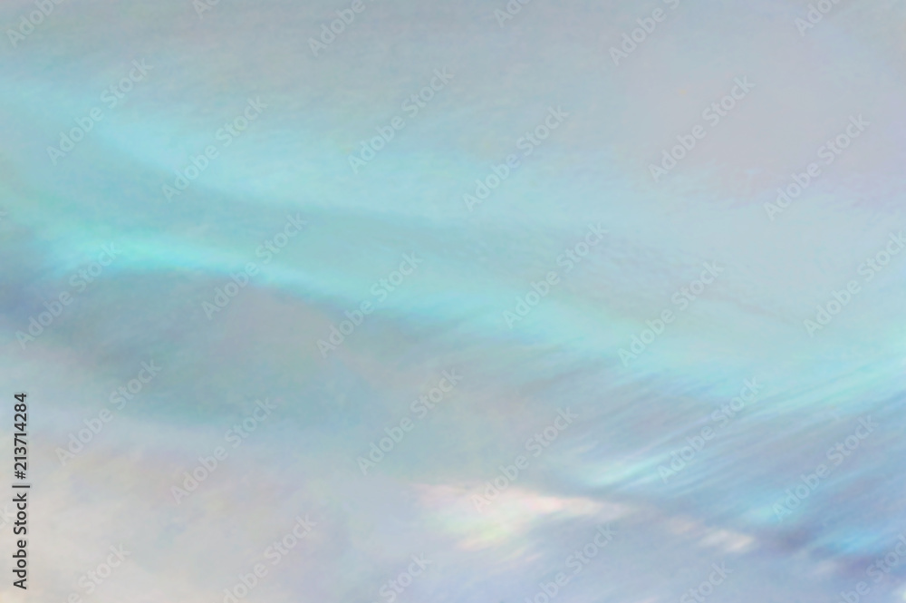 light blue mother of pearl iridescent background. The texture of the ...
