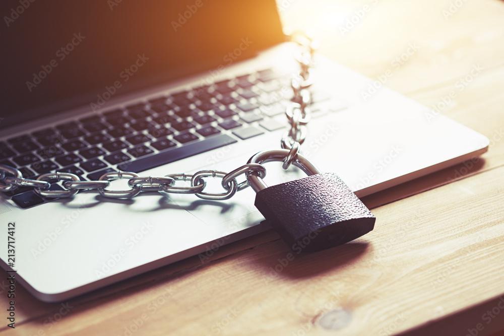 Locked chain on laptop as computer protection and cyber safety concept ...