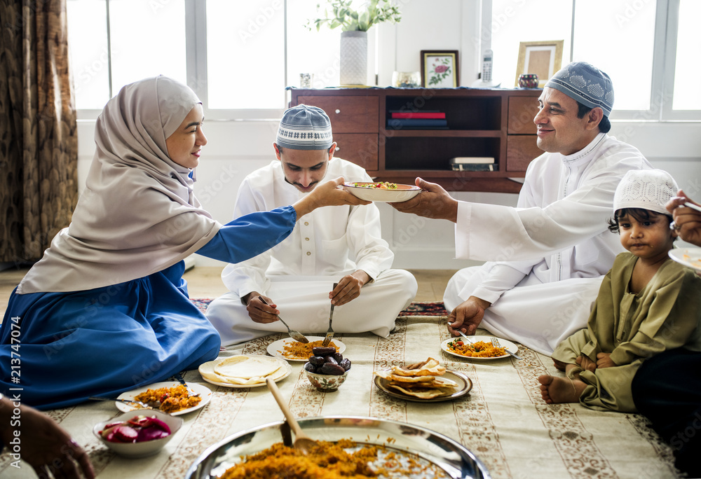 Muslim family having dinner on the floor Stock Photo | Adobe Stock