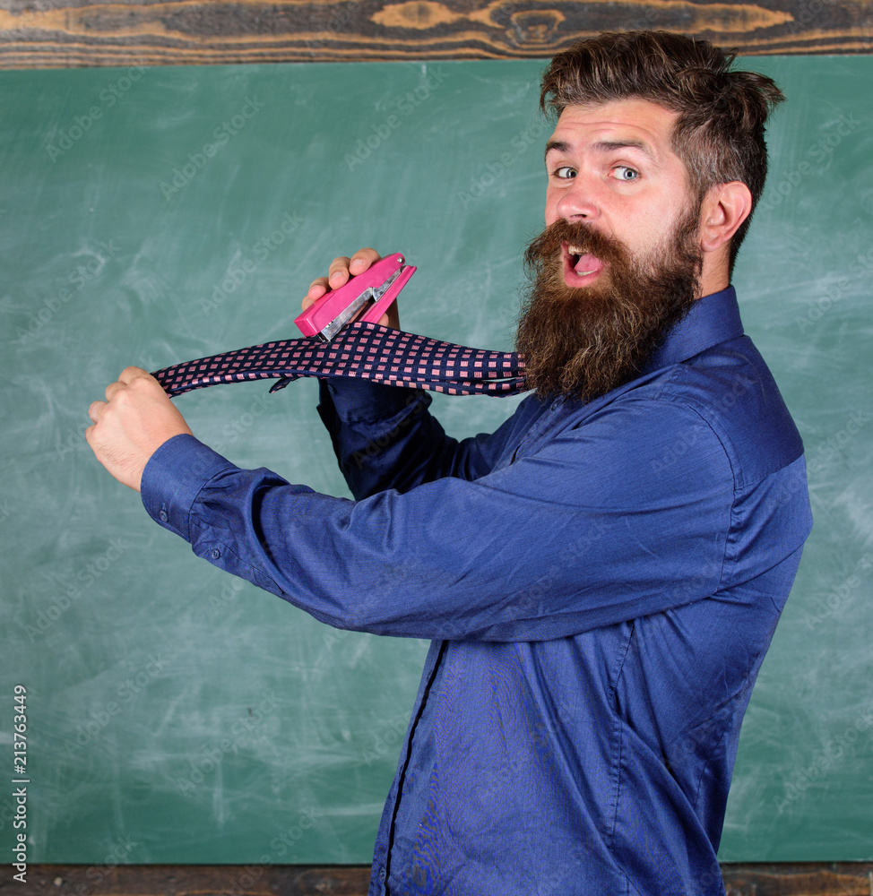 Hipster teacher formal wear necktie holds stapler. School stationery ...
